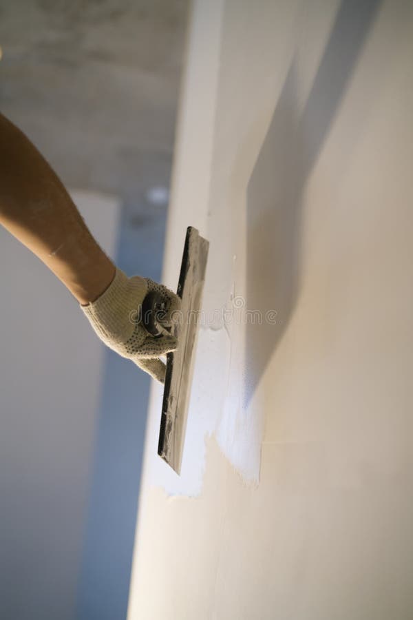 Worker Applying Putty on the Wall with Putty Knife Stock Photo - Image ...