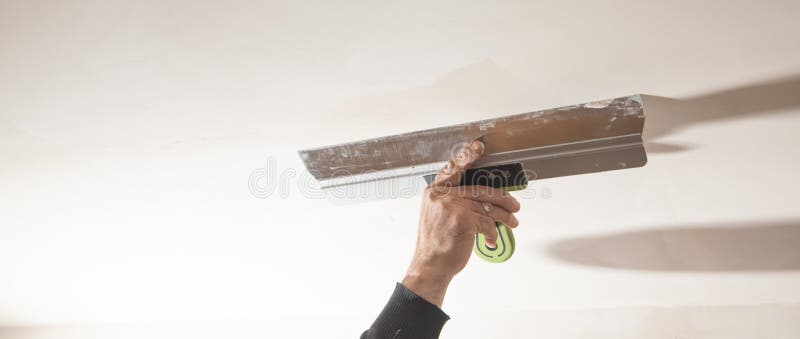 Worker is Applying Putty on a Wall. Renovating House Stock Image ...