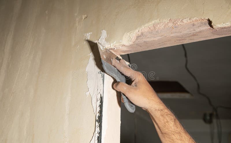 Worker is Applying Putty on a Wall. Renovating House Stock Image ...