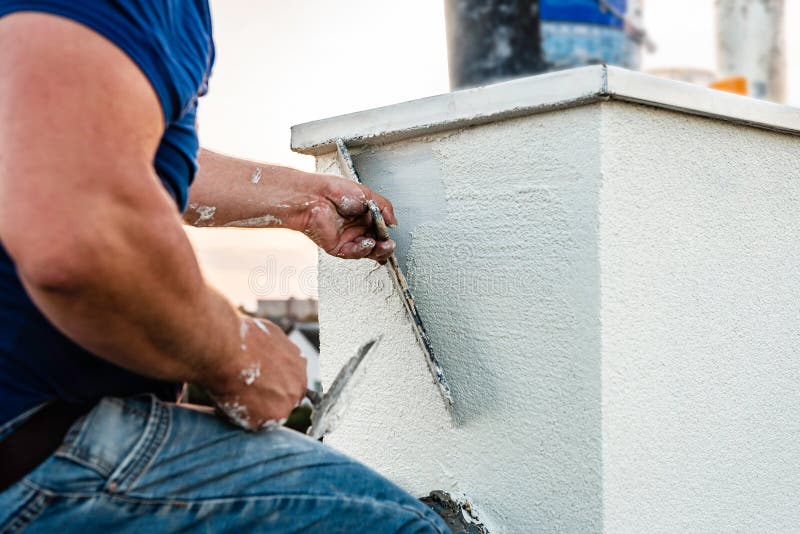 Worker Applying White Seamless Concrete Pebble-dash Plaster on Chimney ...