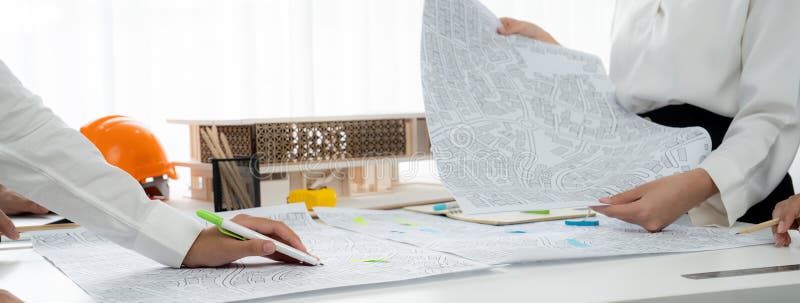 Worker, Architect and Engineer Work on Real Estate Construction Project ...