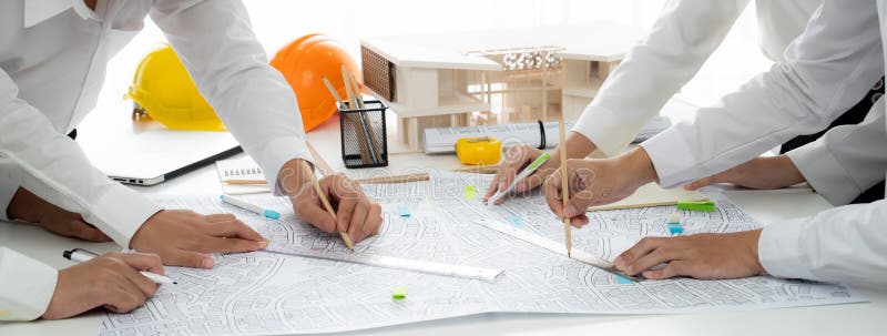 Worker, Architect and Engineer Work on Real Estate Construction Project ...