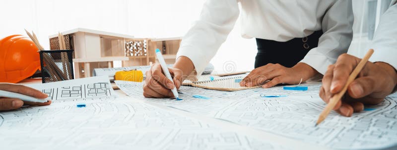 Worker, Architect and Engineer Work on Real Estate Construction Project ...