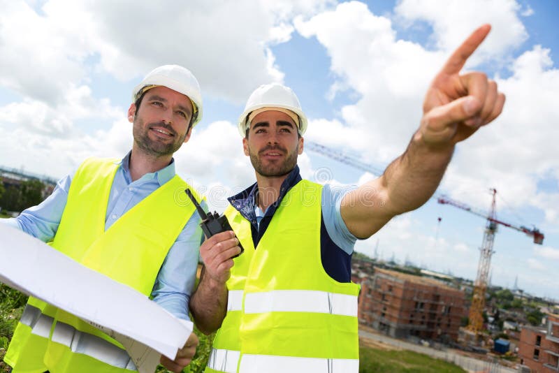 Worker and Architect Watching Some Details on a Construction Stock ...