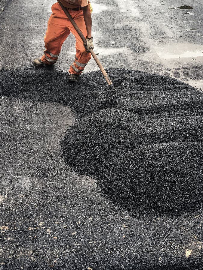 A Worker Asphalt Road in the Summer Stock Photo - Image of shovel ...