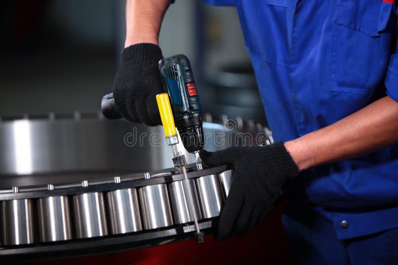 The Worker Assembles the Bearing by Hand. Bearing Production. Bearing ...