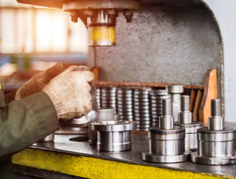 The Worker Assembles the Pressing of the Bearing into a Metal Clip on ...