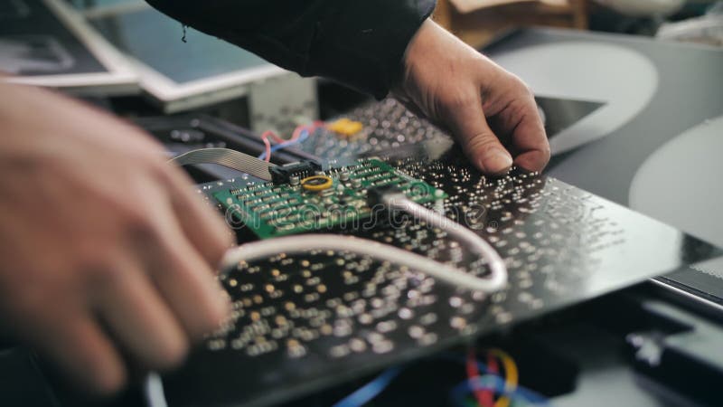 Worker Assembles Traffic Light Microcircuits at the Production Site ...