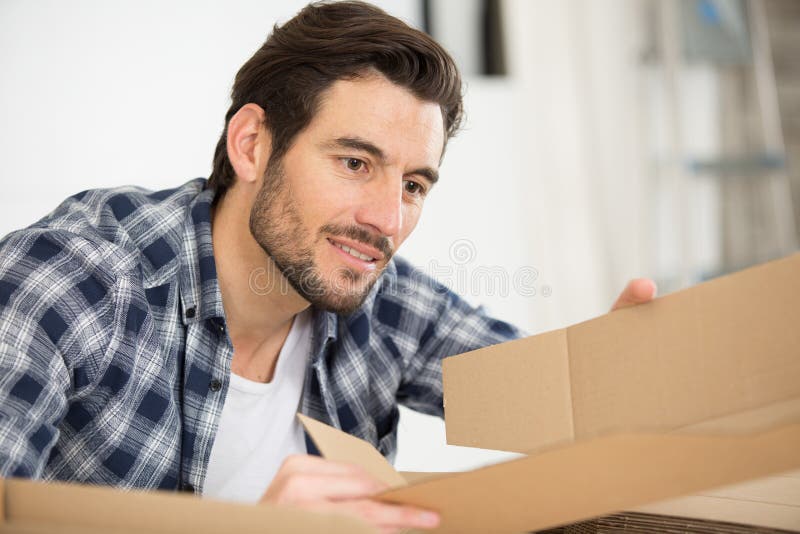 Worker assembling box stock photo. Image of installing - 263893612