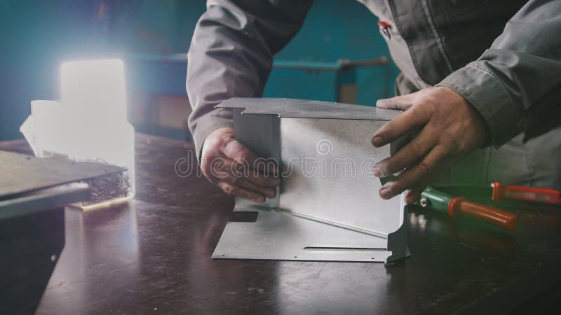 Worker Assembling the Metal Part in the Manual Stock Photo - Image of ...