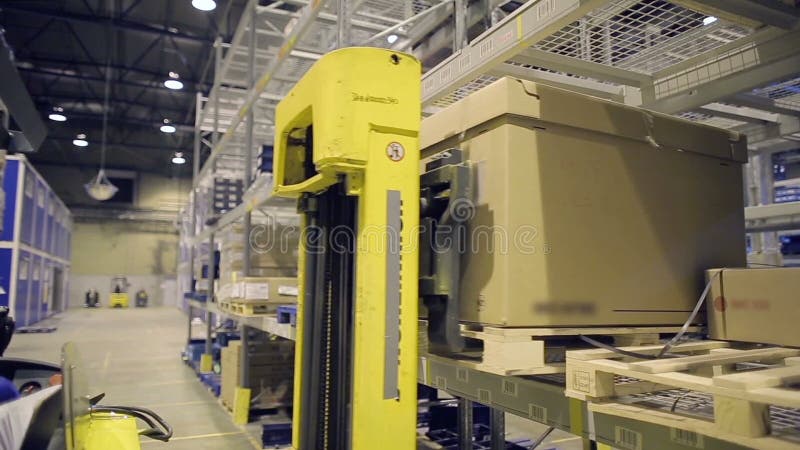 Worker on Autoloader Taking Box from Rack Stock Video - Video of ...