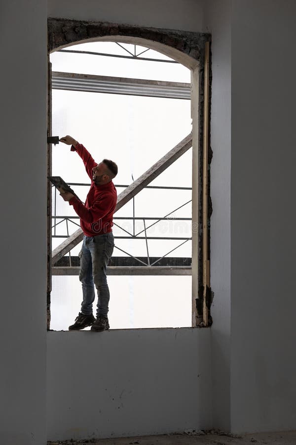 Worker Balancing on a Window while Working Stock Image - Image of ...