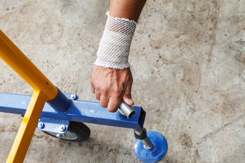 Worker with Bandaged Hand at Work Stock Image - Image of bandage, male ...
