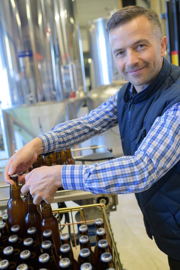 Worker at Beer Bottling Factory Stock Photo - Image of factory ...