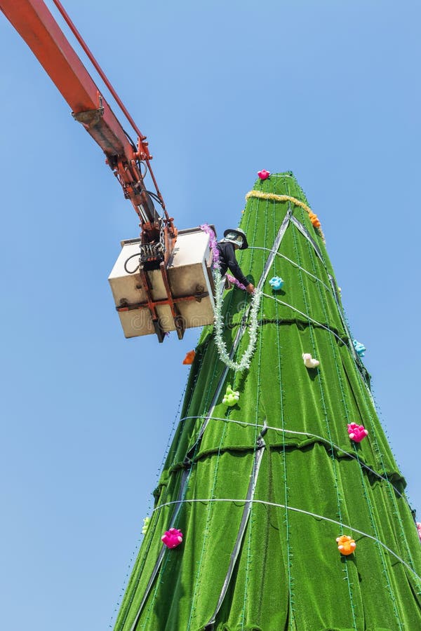 Worker on Big Crane during Install and Decoration Ornament the ...