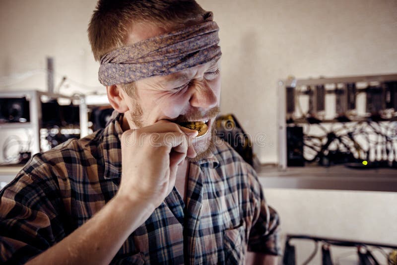 A Man with a Beard Holds a Gold Coin Stock Photo - Image of indoors ...