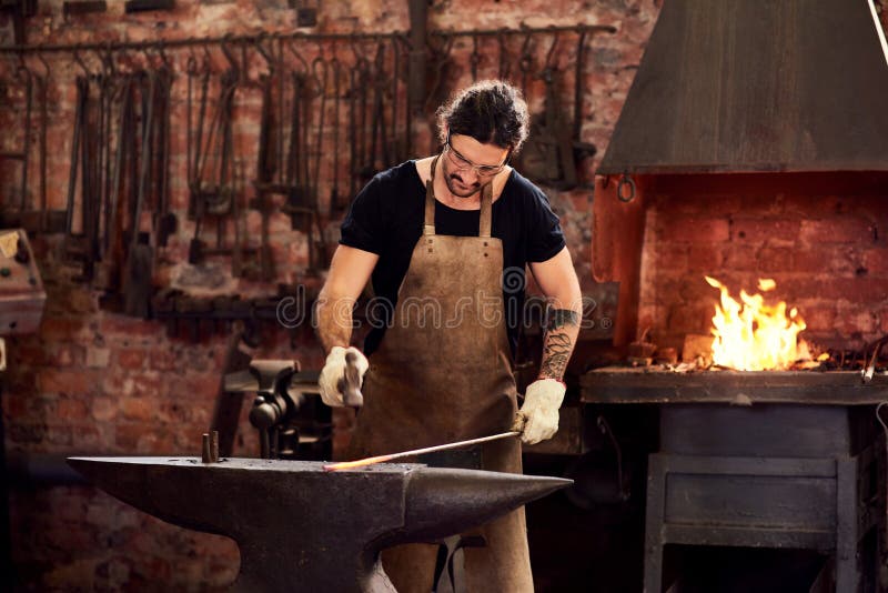 Worker, Blacksmith and Metal Forge in Workshop and Manual Working on ...