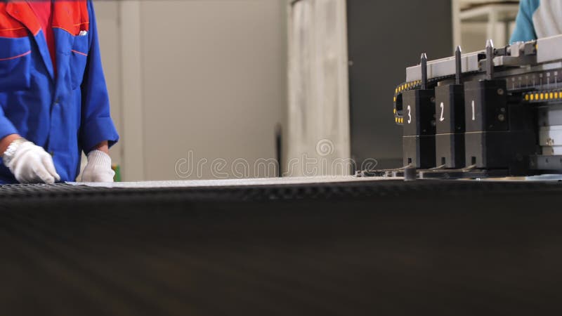 Worker in Blue Uniform Puts Thin Metal Sheets into Machine Stock Video ...