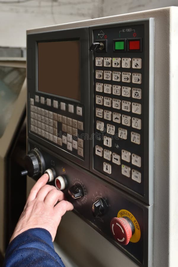 Worker in Blue Workwear Holds Hands on the Control Panel of the CNC ...
