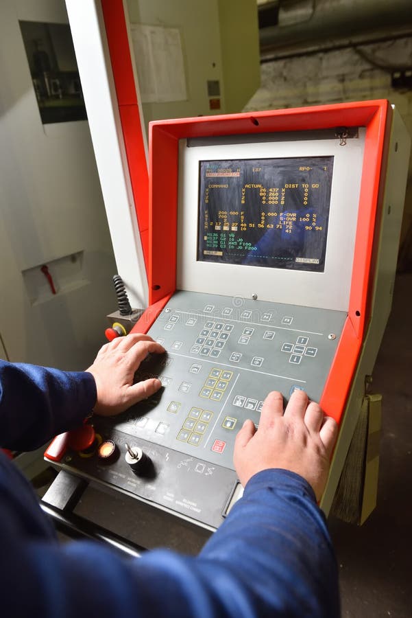 Worker in Blue Workwear Holds Hands on the Control Panel of the CNC ...