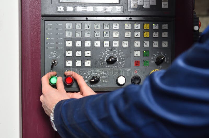 Worker in Blue Workwear Holds Hands on the Control Panel of the CNC ...
