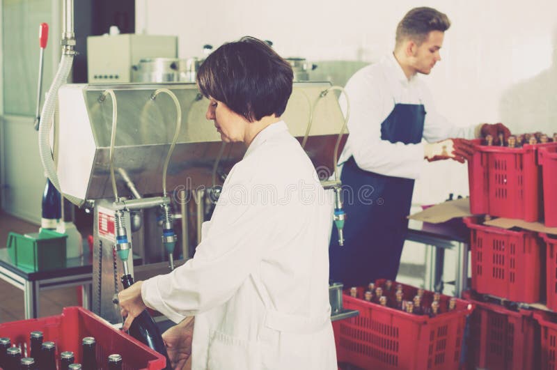 Worker bottling wine stock photo. Image of glass, adult - 87000084