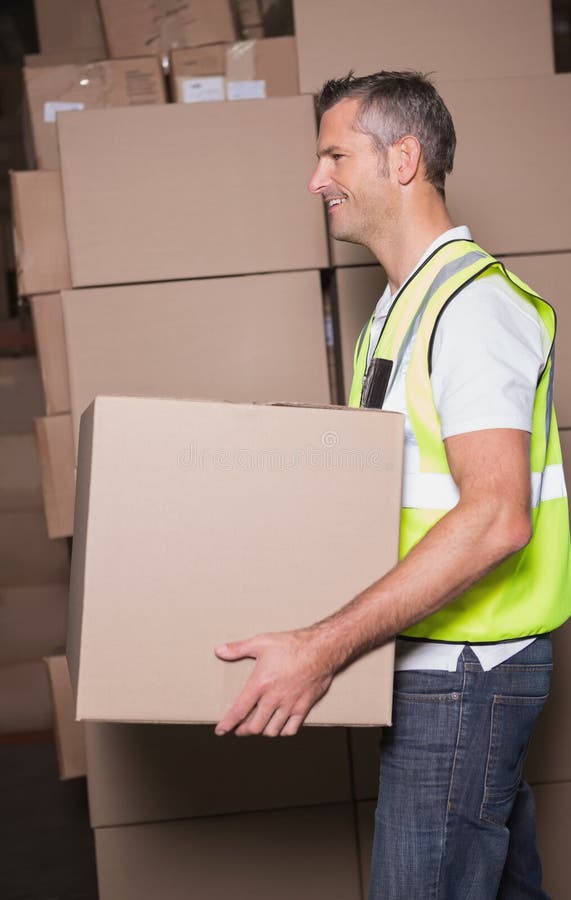 Worker with Boxes in Warehouse Stock Photo - Image of adult, happy ...