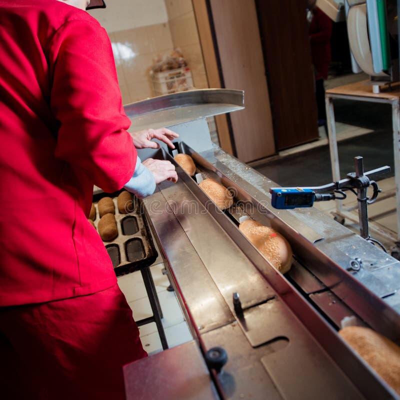 Worker In A Bakery Packaging Bread Stock Photo - Image of industry ...
