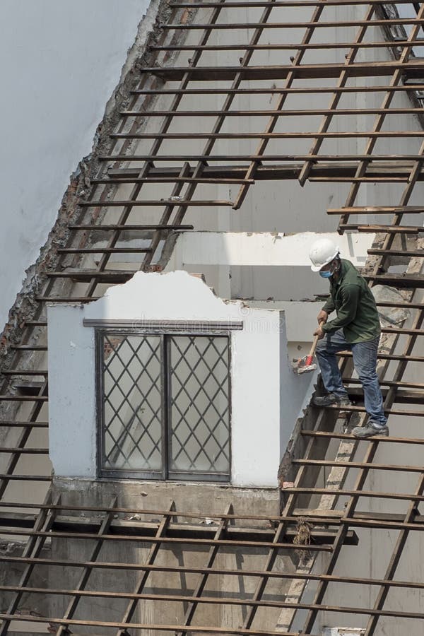 Worker Breaking a House Down with His Hammer in Vietnam Editorial ...