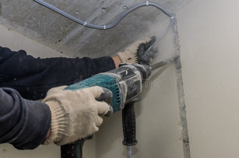 Worker Breaks a Concrete Wall with a Perforator Chisel Stock Image ...