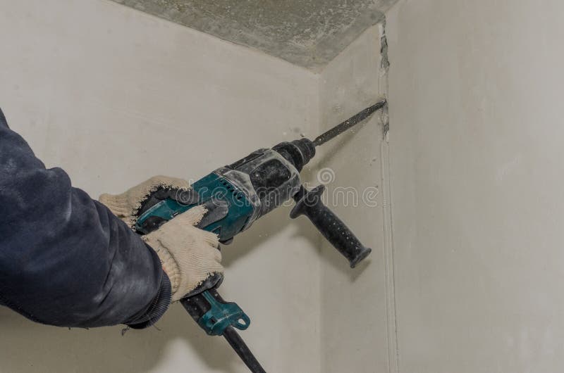 Worker Breaks a Concrete Wall with a Perforator Chisel Stock Photo ...