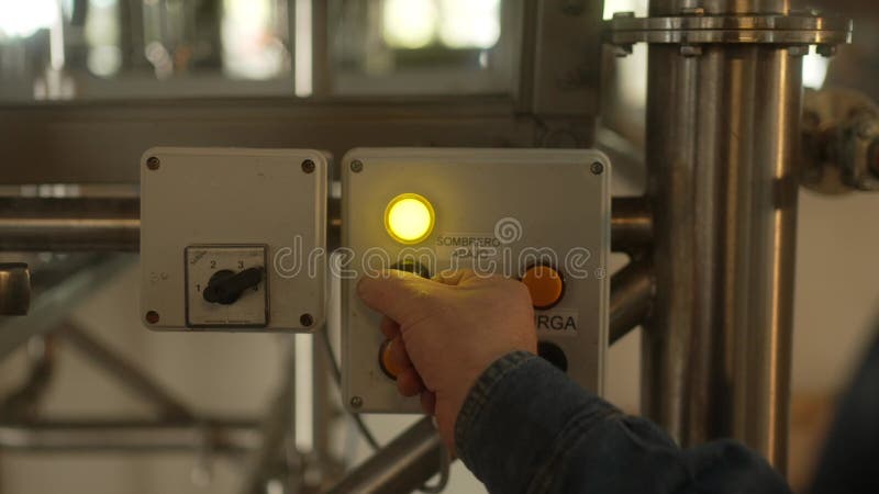 Worker in a Brewery, Switching a Button with Signal Lamp Indicator in ...
