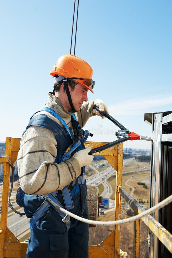 Worker Builder at Facade Construction Works Stock Photo - Image of ...