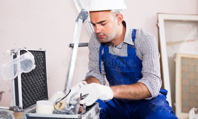 Worker Builder Searching Tools in Toolbox Stock Photo - Image of gloves ...