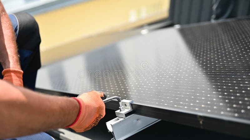 Worker Building Photovoltaic Solar Panel System on Rooftop of House ...