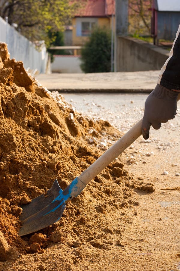 Worker and building sand stock photo. Image of site, pile - 19234420