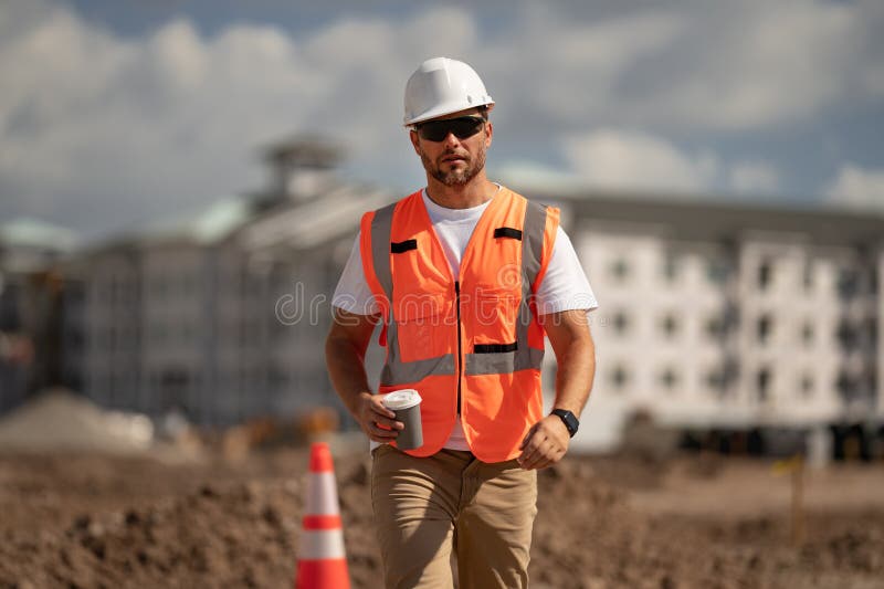 Worker in Building Uniform on Buildings Construction Background ...