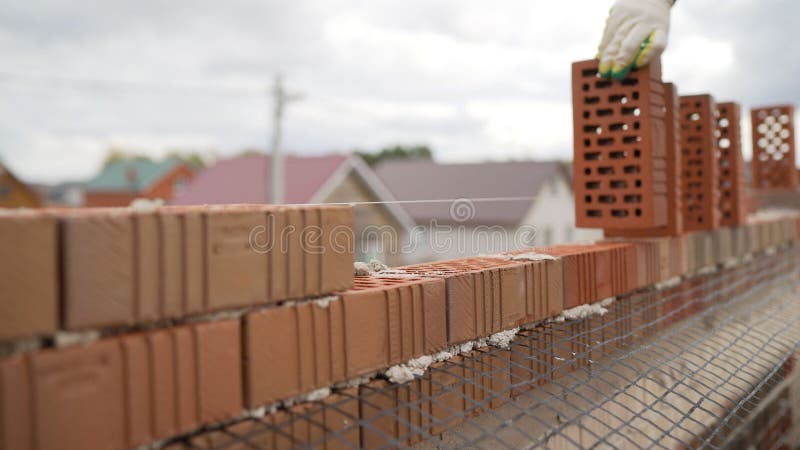Red Brick Wall Laying, Wall Construction Process. Worker is Building ...