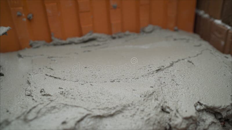 Laying of Red Bricks. a Worker Builds a House Out of Bricks and Mortar ...