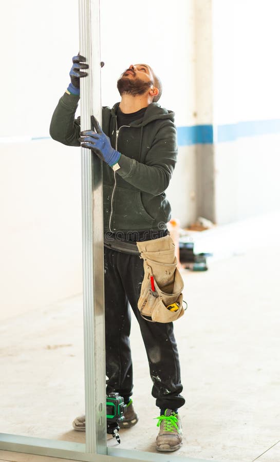 Worker Builds a Plasterboard Wall Stock Image - Image of details, chalk ...