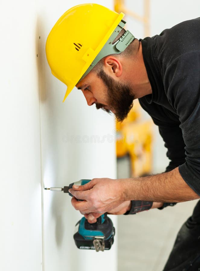 Worker Builds a Plasterboard Wall Stock Photo - Image of chalk, tools ...