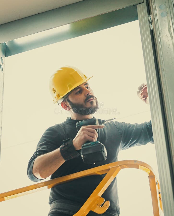 Worker Builds a Plasterboard Wall Stock Image - Image of screwdriver ...