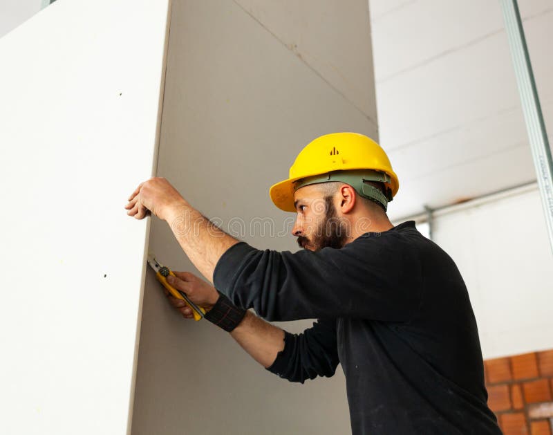 Worker Builds a Plasterboard Wall Stock Photo - Image of craft, drywall ...