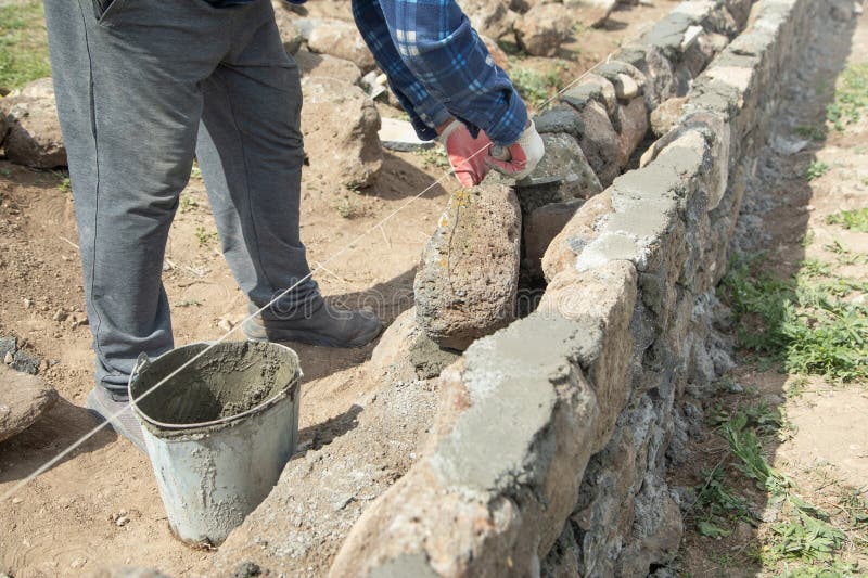 Worker Builds a Wall in the Building Site Stock Image - Image of work ...