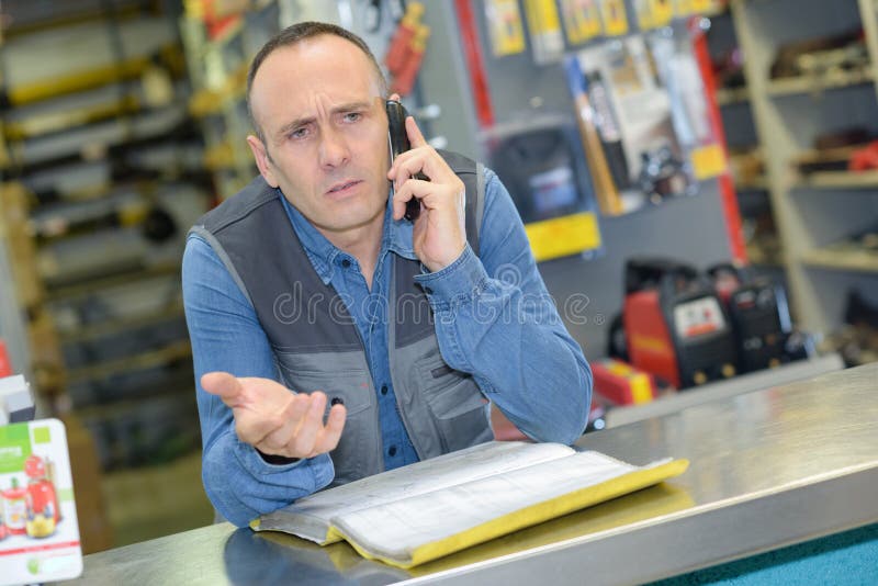 Worker Calling on Phone in Warehouse Stock Image - Image of business ...