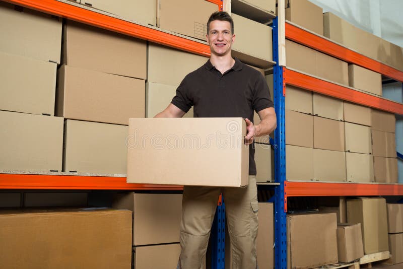 Worker with Cardboard Boxes Writing on Clipboard Stock Image - Image of ...