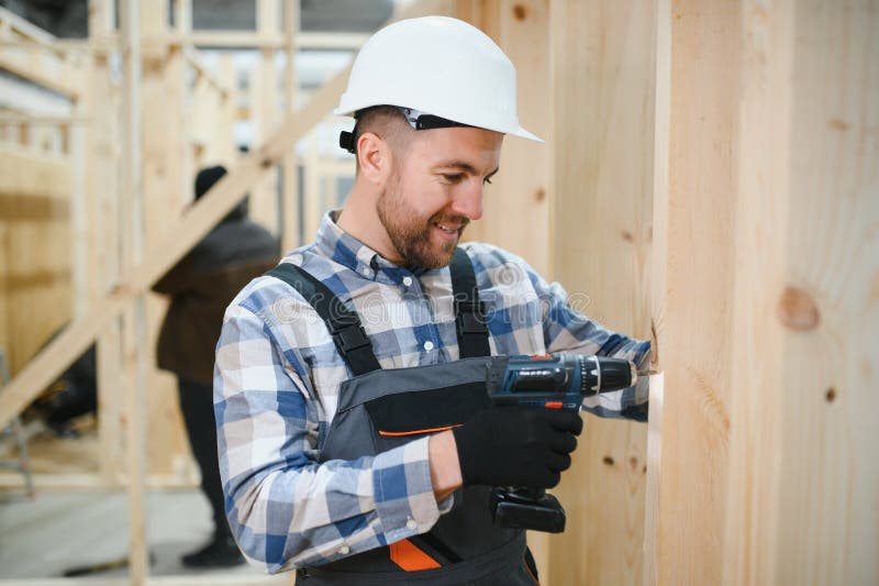 Worker Carpenter Assembling a Modular House Stock Photo - Image of ...