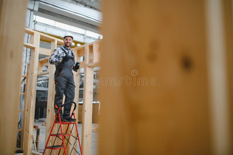 Worker Carpenter Assembling a Modular House Stock Photo - Image of ...