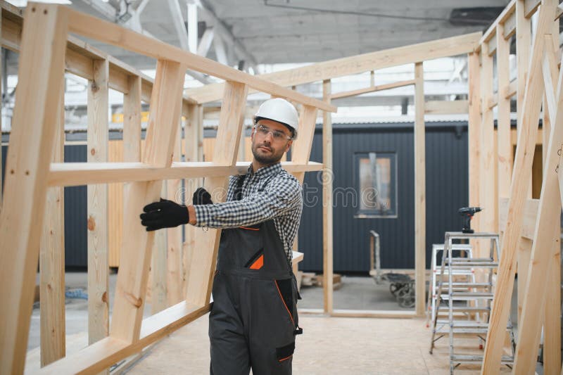 Worker Carpenter Assembling a Modular House Stock Image - Image of ...