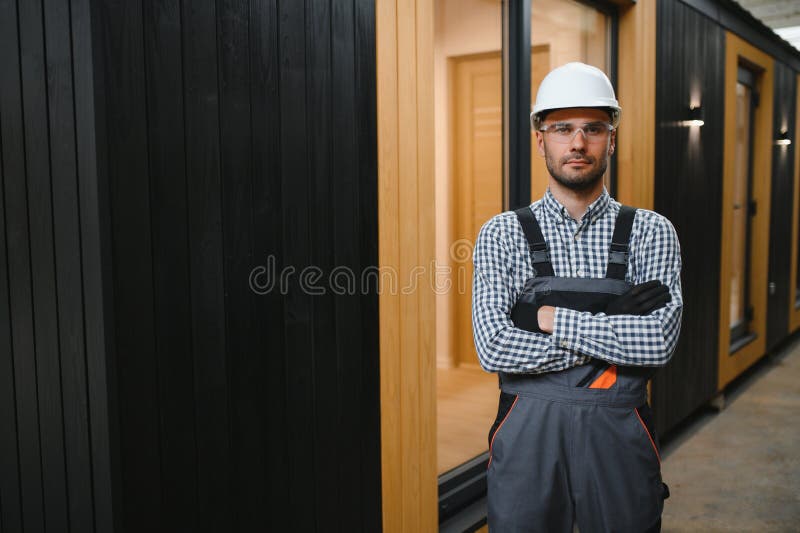 Worker Carpenter Assembling a Modular House Stock Photo - Image of ...